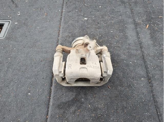 KAY02661XA Mazda корпус + поршень супорта задн (r)