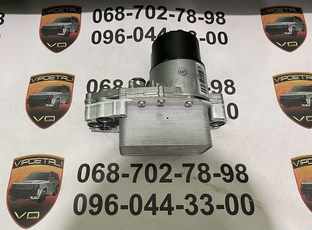 LR124259 Land Rover радиатор масляный (холодильник, под фильтром)