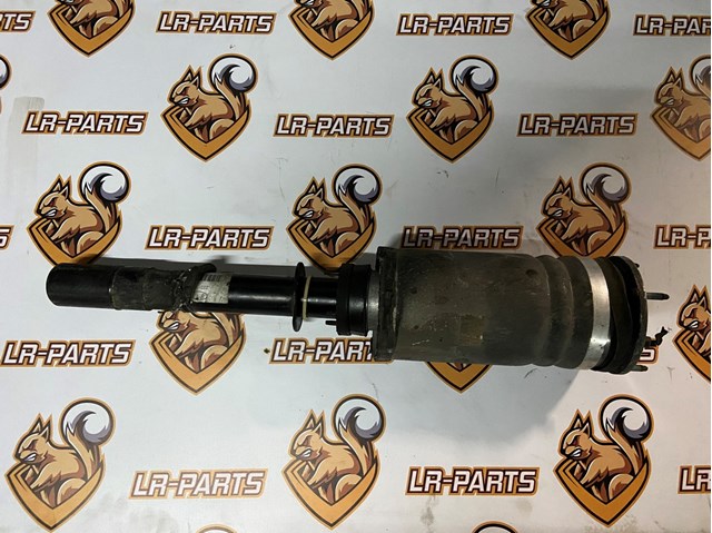 LR072460 Land Rover амортизатор передний левый