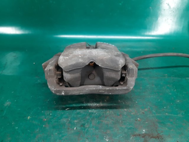 34116778335 BMW суппорт тормозной передний левый